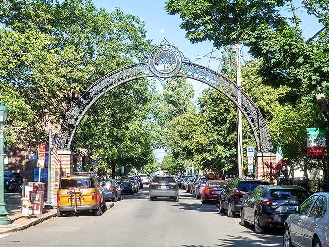 That decorative archway welcomes you into a neighborhood square that could easily be mistaken for Italy.