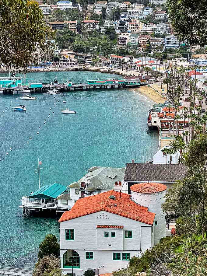 That crystal-clear water lets you count fish from the pier while colorful boats bob peacefully in the Mediterranean-style bay.