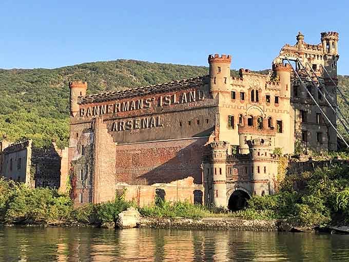 Golden hour light bathes the crumbling arsenal walls, making "Bannerman's Island" lettering glow like a vintage postcard come alive.
