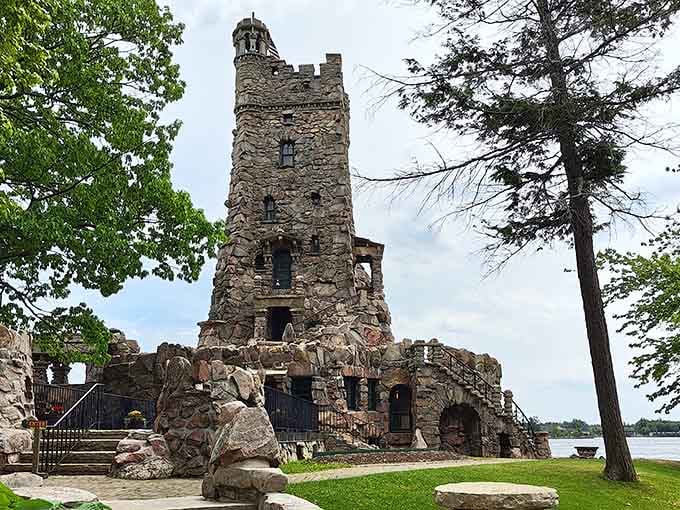 The weathered stone tower stands sentinel over the water, holding centuries of stories within its crumbling walls.