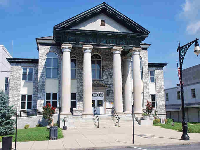 Classical columns stand proud on this courthouse, proving small towns can do grand architecture with serious style.