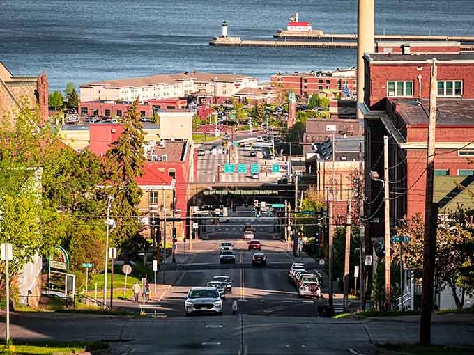 The street slopes toward Lake Superior's endless blue horizon, where fresh air comes with a side of maritime magic.