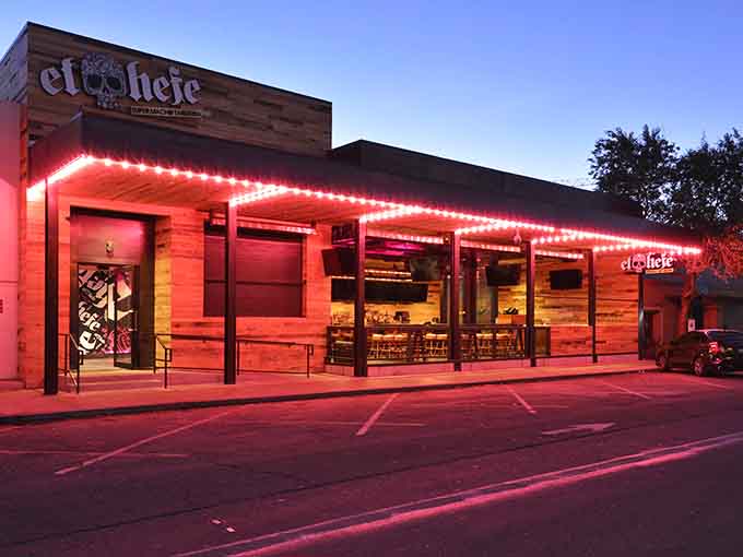 Those illuminated red strips frame the wooden facade, creating an inviting atmosphere where Mexican food meets contemporary style perfectly.