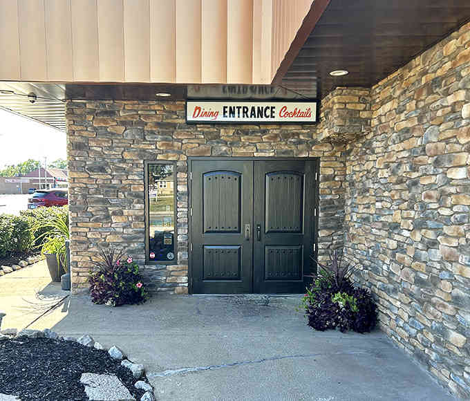 The stone entrance with its welcoming double doors practically begs you to step inside and experience something truly special today.