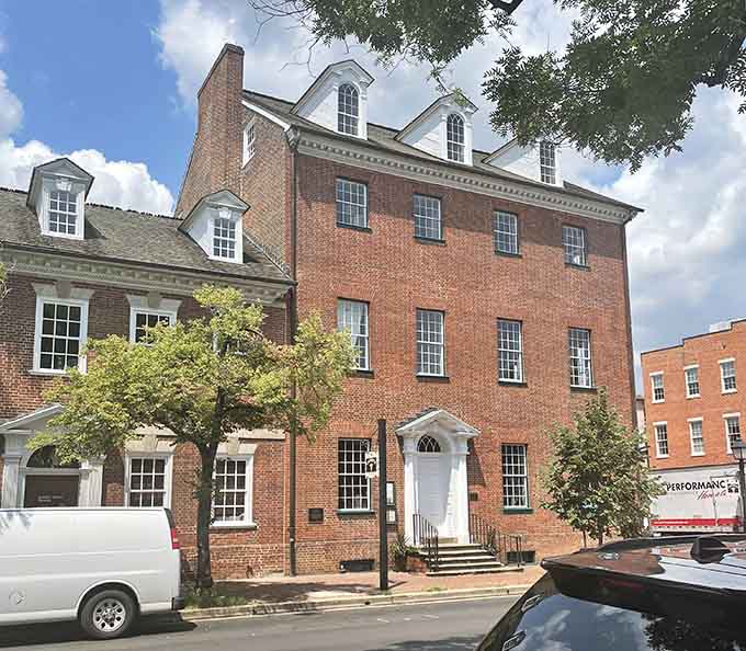 That white doorway and tall windows have welcomed travelers for centuries, and they're still looking sharp.