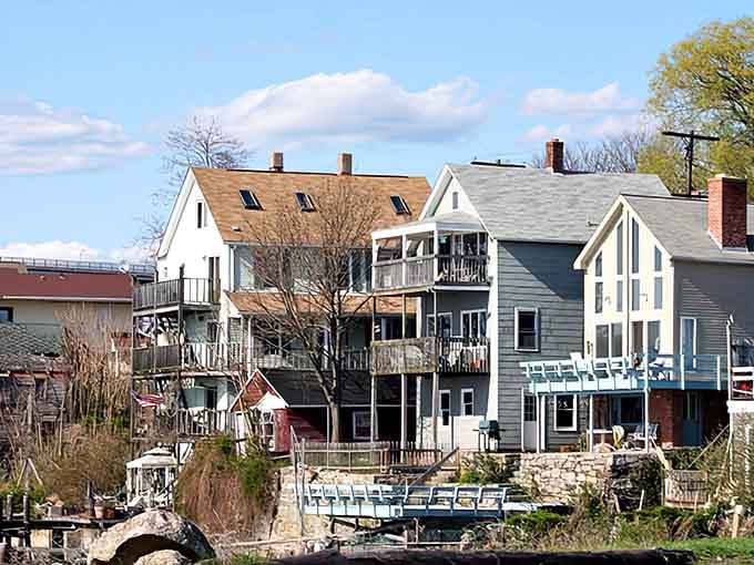 Colorful houses line the water's edge where residents enjoy front-row seats to the daily parade of boats and submarines.
