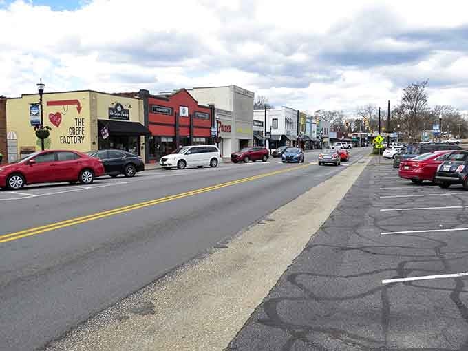 Colorful storefronts line up like a rainbow of possibilities, each one locally owned and genuinely happy to see you.