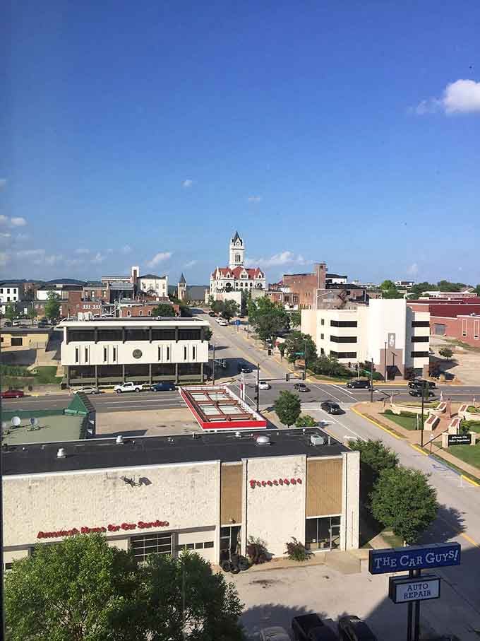Jefferson City's charming downtown showcases the beautiful Cole County Courthouse tower rising above local businesses, blending historic architecture with modern small-city convenience.