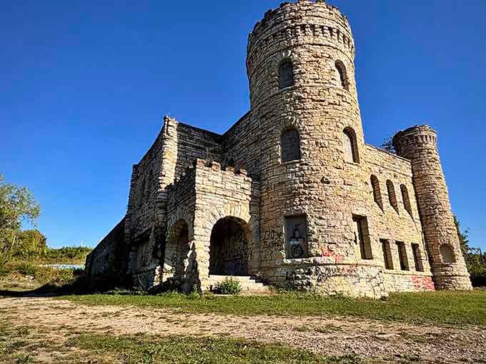 Afternoon light bathes these castle ruins in golden warmth, transforming abandoned architecture into something almost magical and timeless.