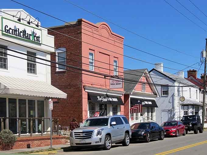 Those colorful storefronts pop against the sky like a paint-by-numbers kit that actually turned out perfect.