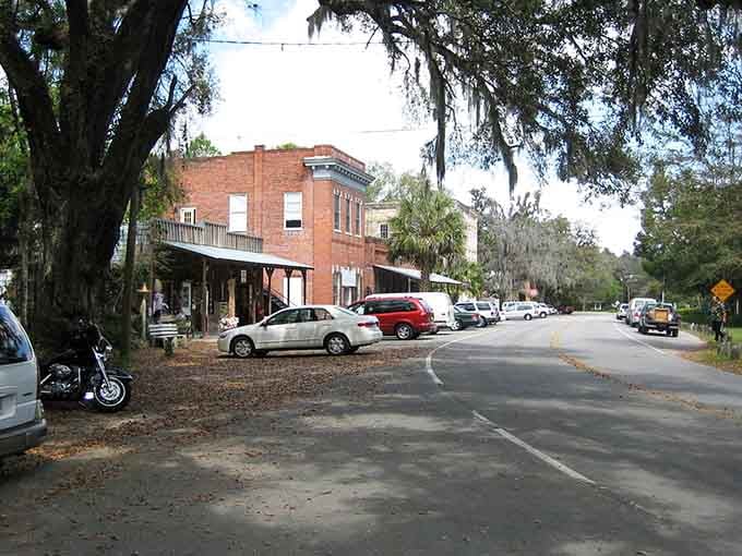 Old brick buildings wear their age proudly on a quiet street where antique shops outnumber everything else combined.