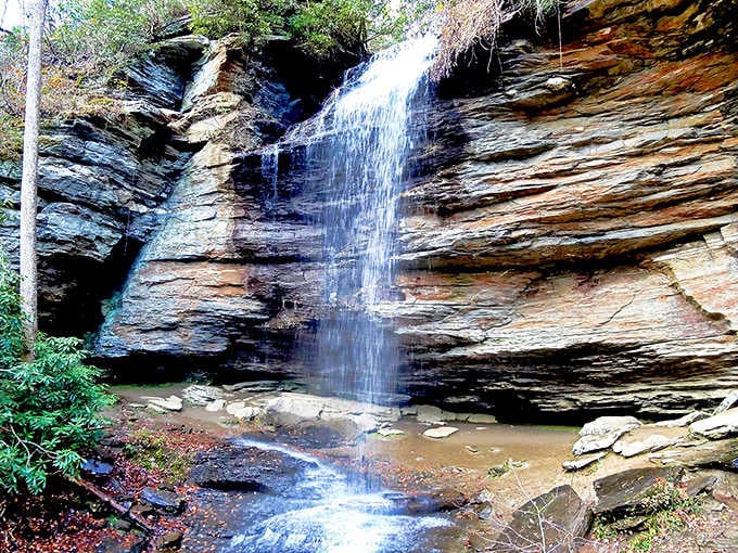 Water sheets down those layered rock faces like silk curtains, creating nature's most elegant room divider.