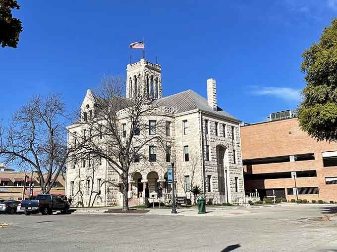 That ornate tower rising above limestone walls brings Romanesque grandeur to the heart of Hill Country living.