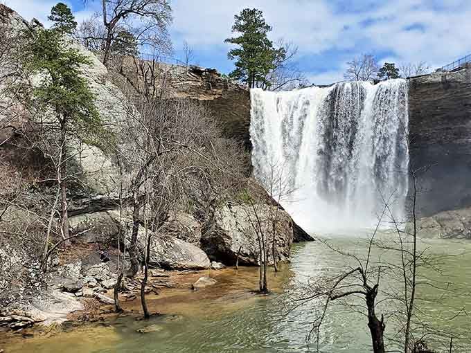 The sheer power of this waterfall sends mist rising like applause from an audience of ancient rocks.