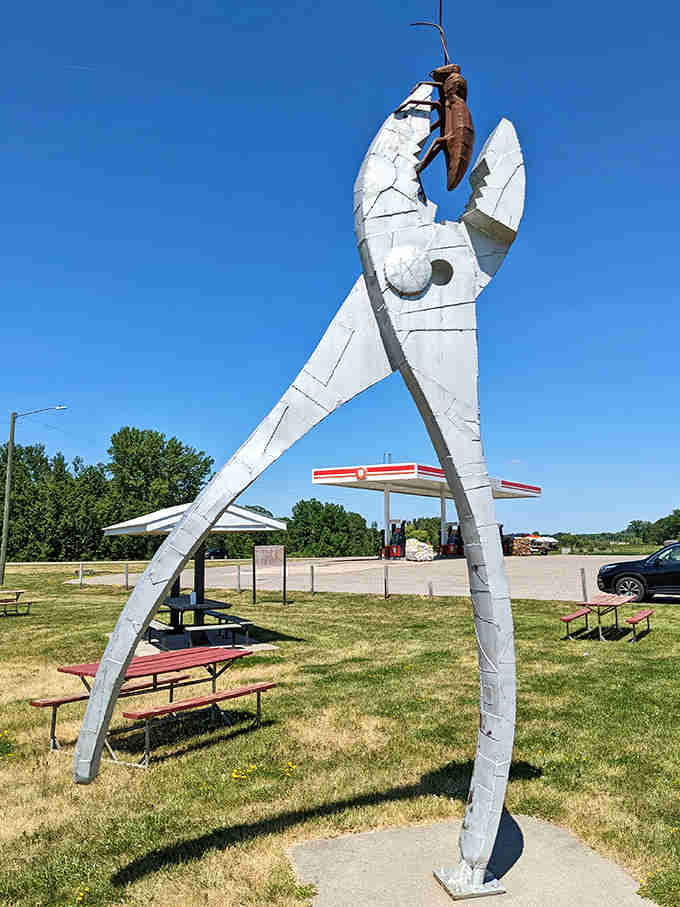 Standing tall against blue skies, this welded wonder transforms everyday metal into something magnificently larger than life itself.