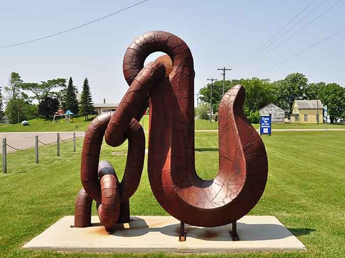 Massive chain links twist together in rust-colored glory, symbolizing strength and connection through industrial beauty.
