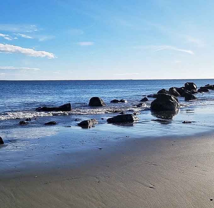 These scattered rocks create perfect perches for contemplation while gentle waves whisper their timeless coastal stories.