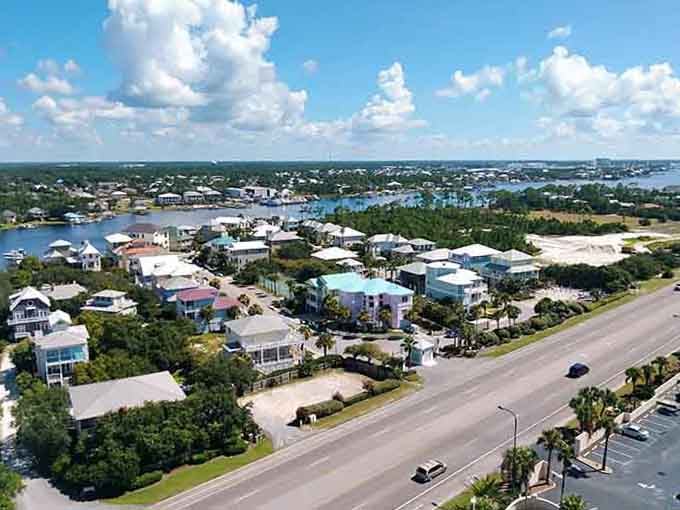 Those pastel beach houses line up like a rainbow convention, each one whispering promises of endless summer days ahead.