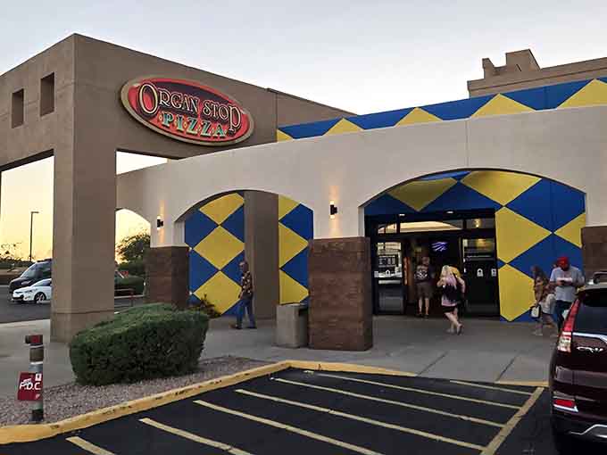 The geometric facade promises something delightfully different from your typical neighborhood pizza joint experience awaits within.