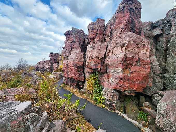 Towering stone pillars glow in sunset shades, their sacred surfaces carved smooth by generations of respectful hands.
