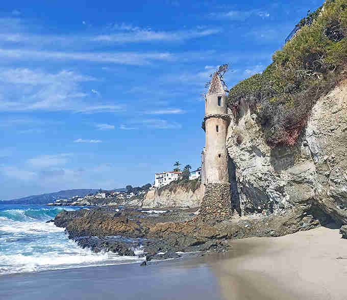 Ocean spray meets ancient stone as this mysterious tower guards the shoreline like a sentinel from some forgotten maritime tale.