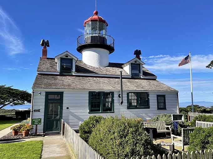 Manicured gardens and white picket fences give this coastal beacon the welcoming charm of a beloved neighborhood landmark.
