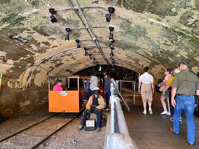 Deep beneath Kentucky's mountains, this vintage mine car carries curious explorers through tunnels where coal dust once danced in lamplight.