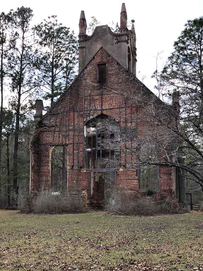 The brick facade reveals layers of history, each crack and missing piece telling stories that textbooks never captured.