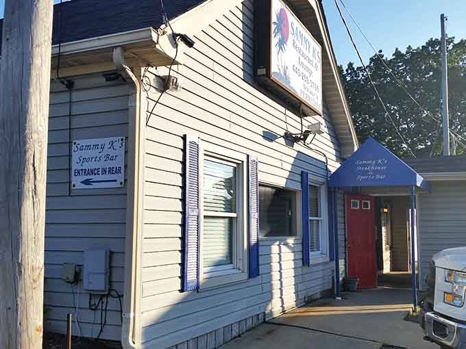 That simple doorway and humble siding prove you don't need fancy architecture when your steaks do all the talking.
