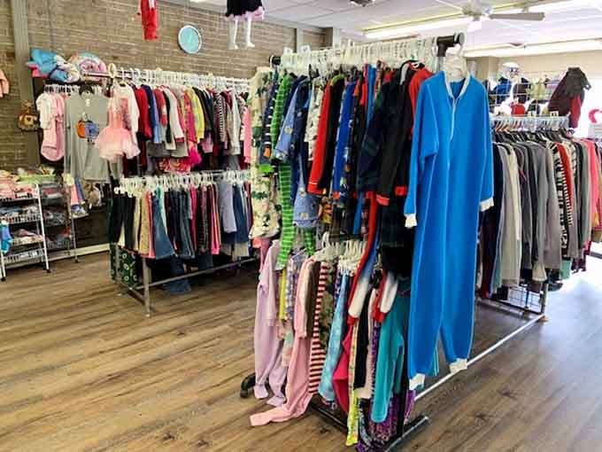 Bright clothing racks pop with every color imaginable, from soft pastels to bold primary hues.