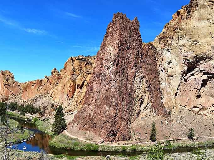 That massive red formation juts skyward with the kind of presence that makes you feel wonderfully small inside.