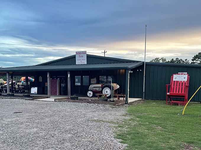 That oversized red chair and vintage tractor create the perfect "wish you were here" farm scene.