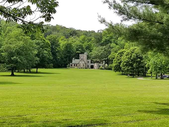 This Tudor Revival masterpiece sprawls across manicured grounds like a scene from Downton Abbey.