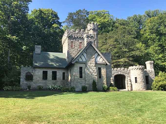 Green lawns and medieval architecture create an enchanting scene that's equal parts peaceful park and mysterious fairy tale.