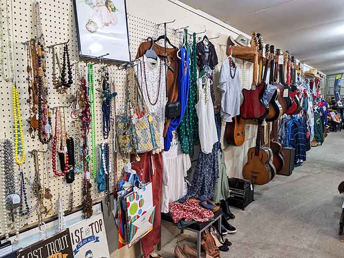 Guitars, vintage clothing, and beaded necklaces hang together creating a wall of nostalgic eye candy inside.
