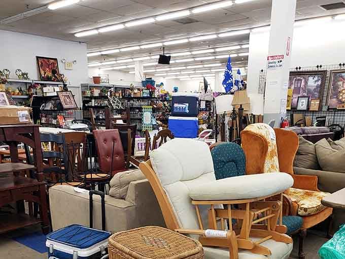 Furniture arranged like a cozy living room showroom, proving one person's castoffs become another's perfect vintage find.
