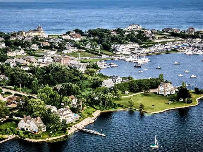 This aerial perspective captures coastal Connecticut at its finest - where sailboats dot the harbor like scattered white confetti.