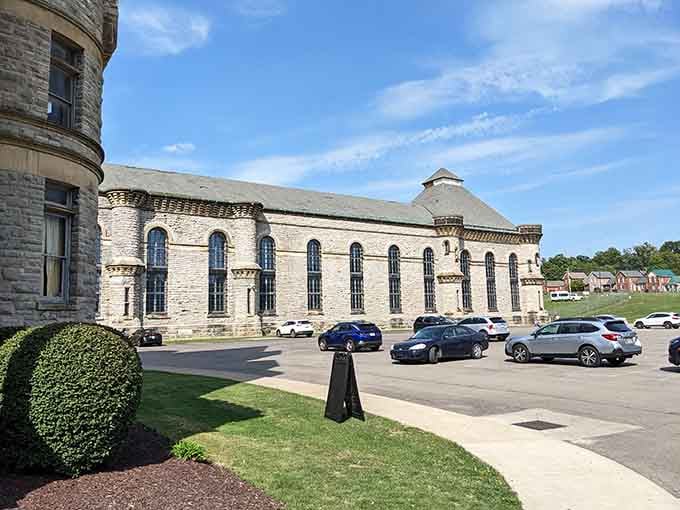 The imposing limestone walls and arched windows tell stories of a bygone era in American corrections.