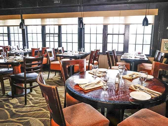 Sunlight streams through those magnificent windows, illuminating tables set and ready for an unforgettable seafood feast ahead.