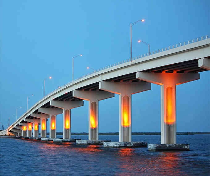 Those glowing orange pillars transform an ordinary bridge into a stunning light show at twilight hours.