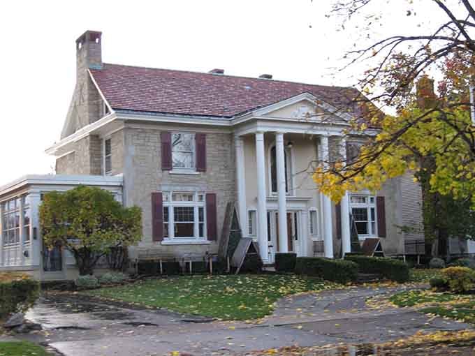 Grand columns frame this Tonawanda mansion, proving that elegant living existed here long before anyone invented the word "McMansion."