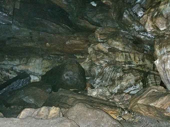 Deep within the cave's mysterious depths, limestone formations create an alien landscape of geological wonder.