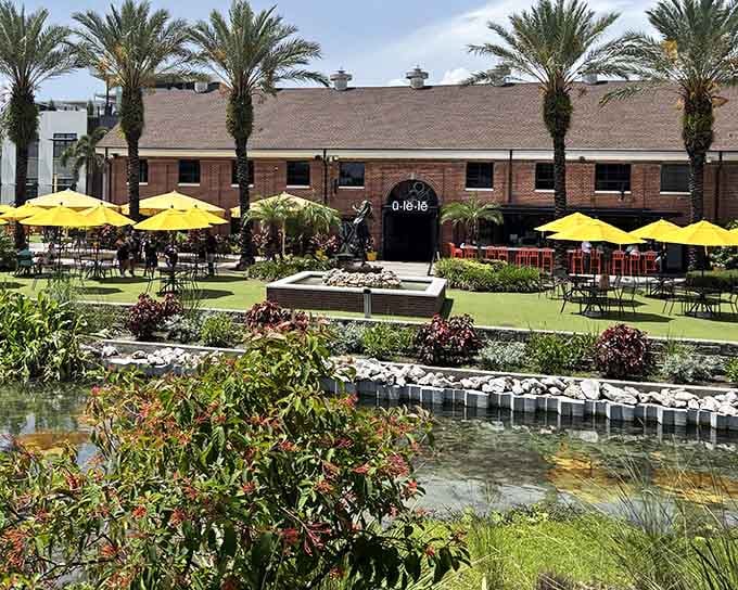 Manicured gardens and reflecting pools create an oasis where palm trees stand guard over alfresco dining tables.