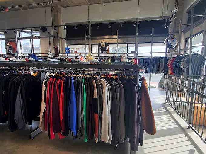 Sunlight streams through windows onto organized racks where trendy pieces wait patiently for their next fashion-forward owner.