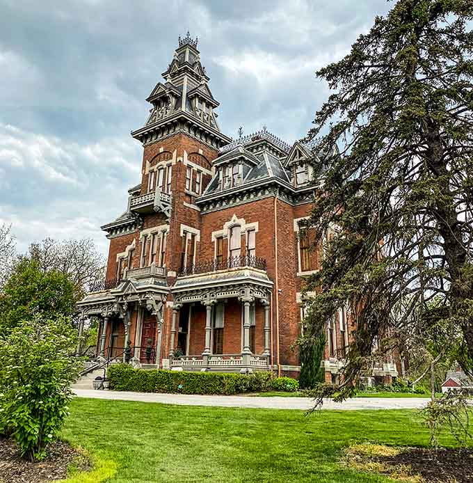 Surrounded by lush greenery, this ornate mansion proves that beauty and mystery make surprisingly compatible neighbors here.