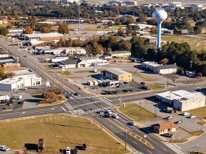 Wide boulevards stretch toward the horizon, showing a city with room to breathe and affordable space.