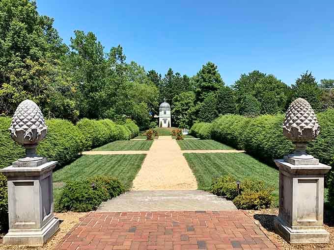 Those pineapple finials and manicured hedges create garden rooms fancier than most people's actual living rooms back home.