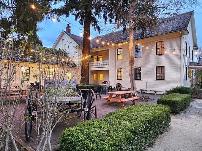 String lights twinkle above the courtyard as evening settles in, creating an atmosphere that whispers "stay a while longer."