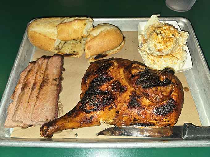 Half chicken, brisket, and all the fixings make this combo plate a barbecue lover's dream come true.