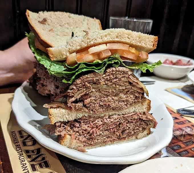 That corned beef tower defies gravity and common sense, stacked higher than most people's lunch expectations combined.